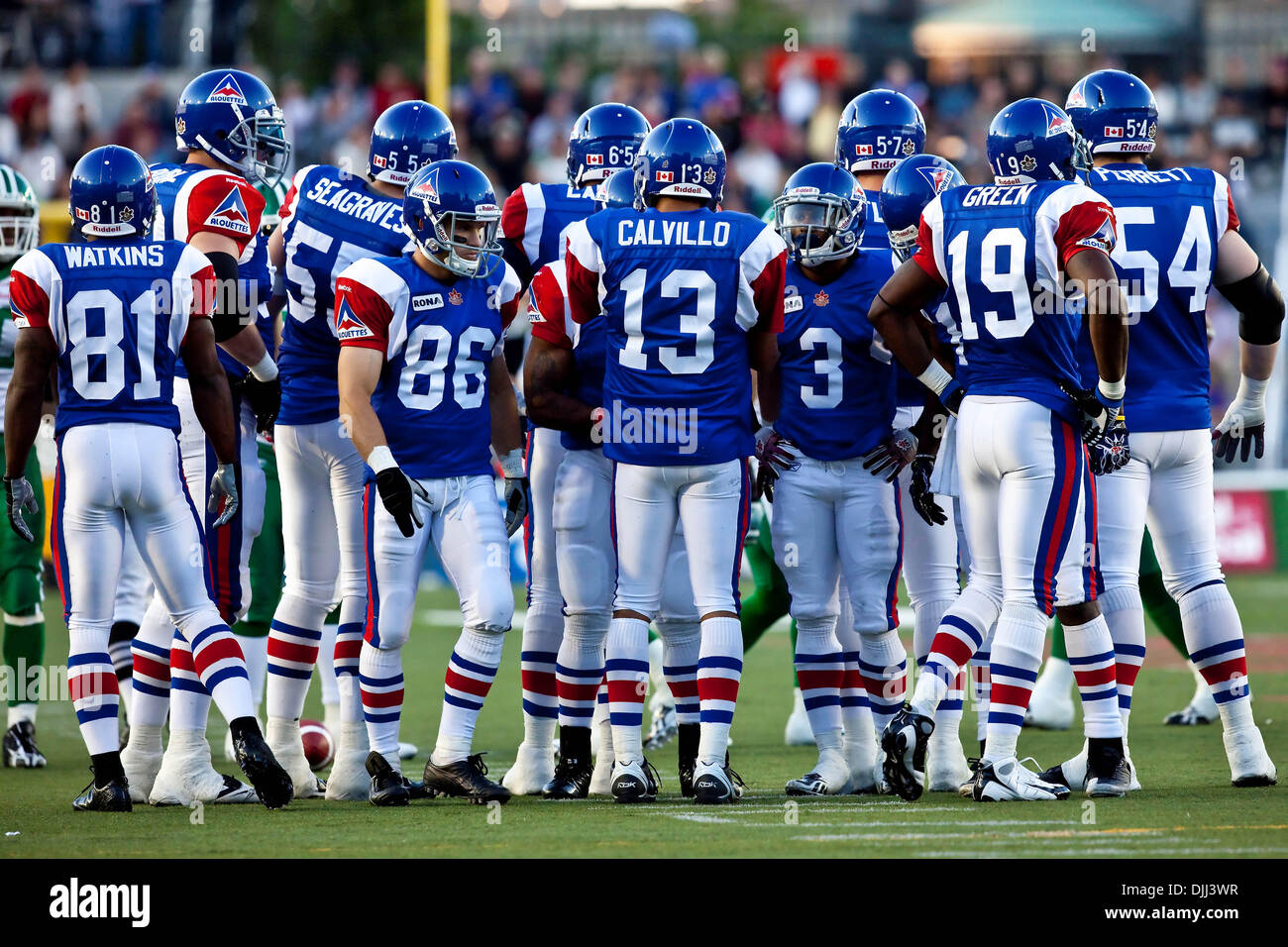 Montreal players huddle during a CFL football game between the Montreal ...