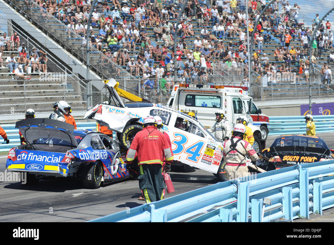 August 7, 2010: Safety crews rush to the scene following a lap 23 ...
