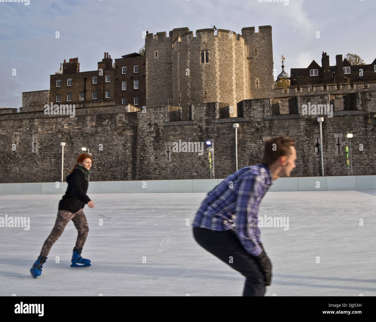 YOUNG PEOPLE ENJOY SKATING AT THE ICE RINK AT THE TOWER OF LONDON OVER ...