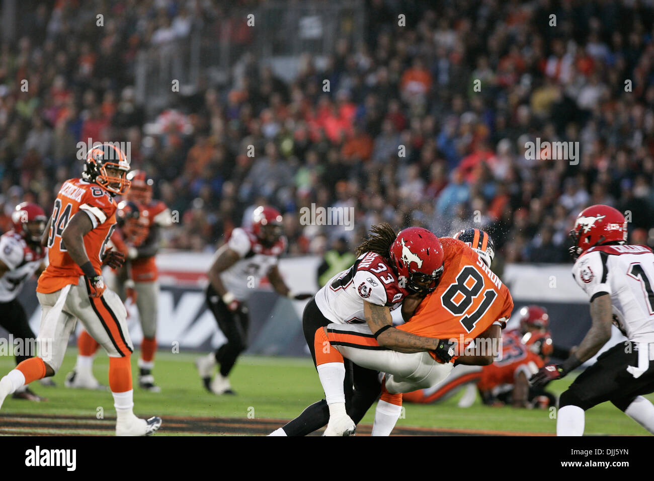7th of August: BC Lions #81 Geroy Simon tackled by #33 Dwight Anderson ...