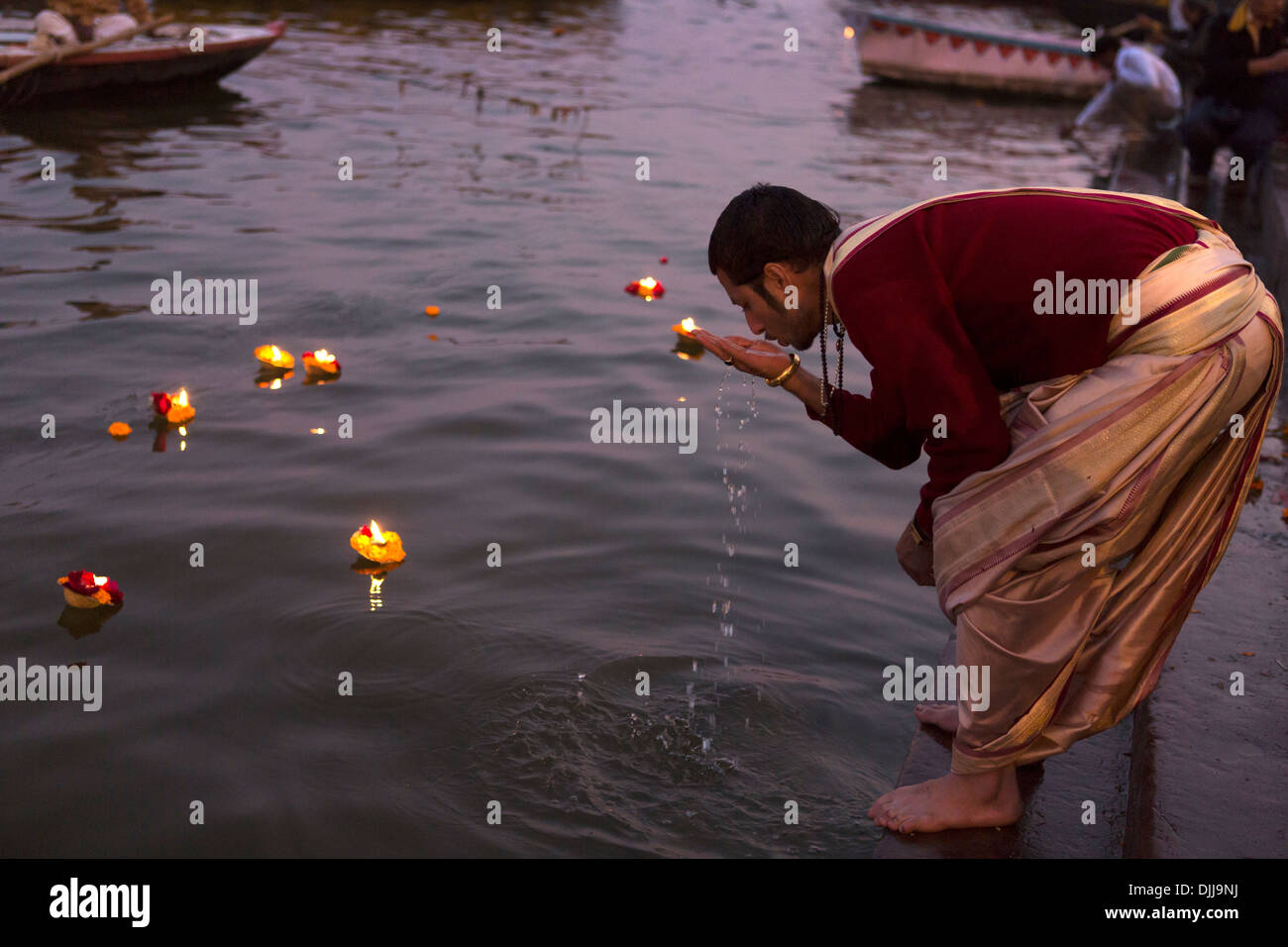 A Hindu religious doing his ablutions shortly before beginning the ...