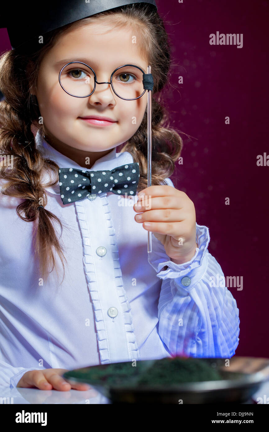Portrait of lovely little girl posing with glasses Stock Photo - Alamy