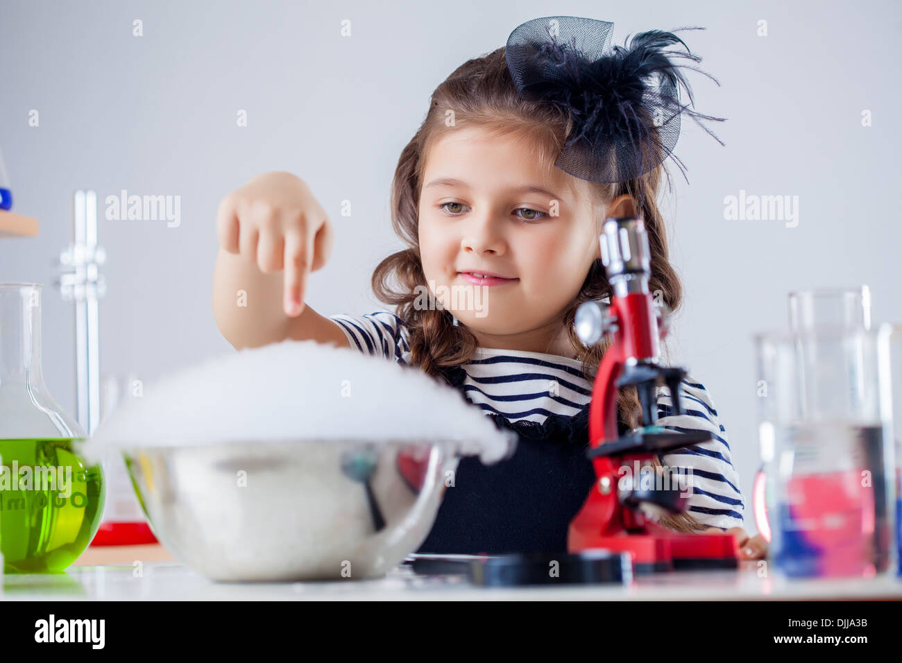 Cute naturalist conducting experiment in lab Stock Photo - Alamy