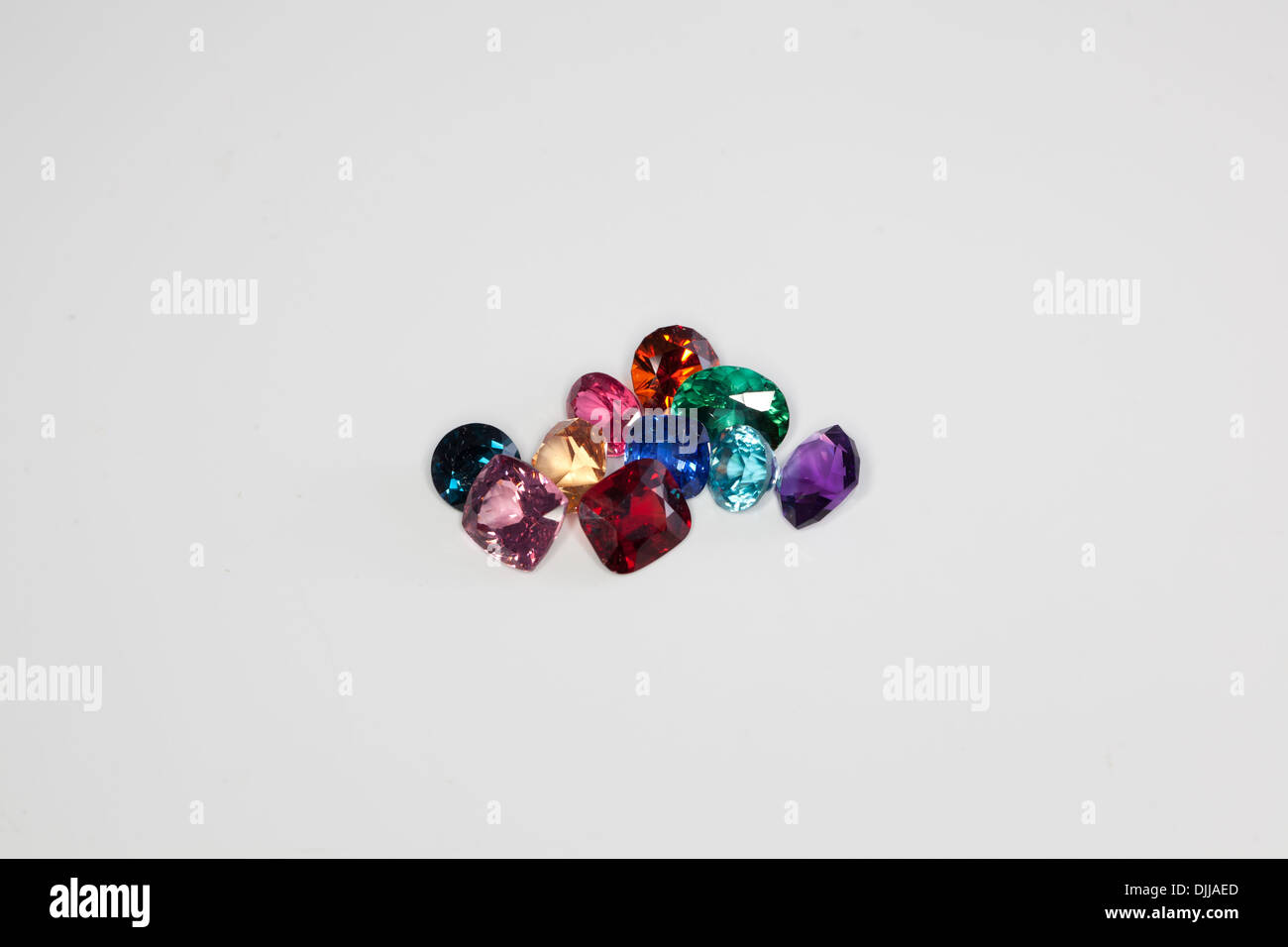Various gemstones on a white background Stock Photo - Alamy