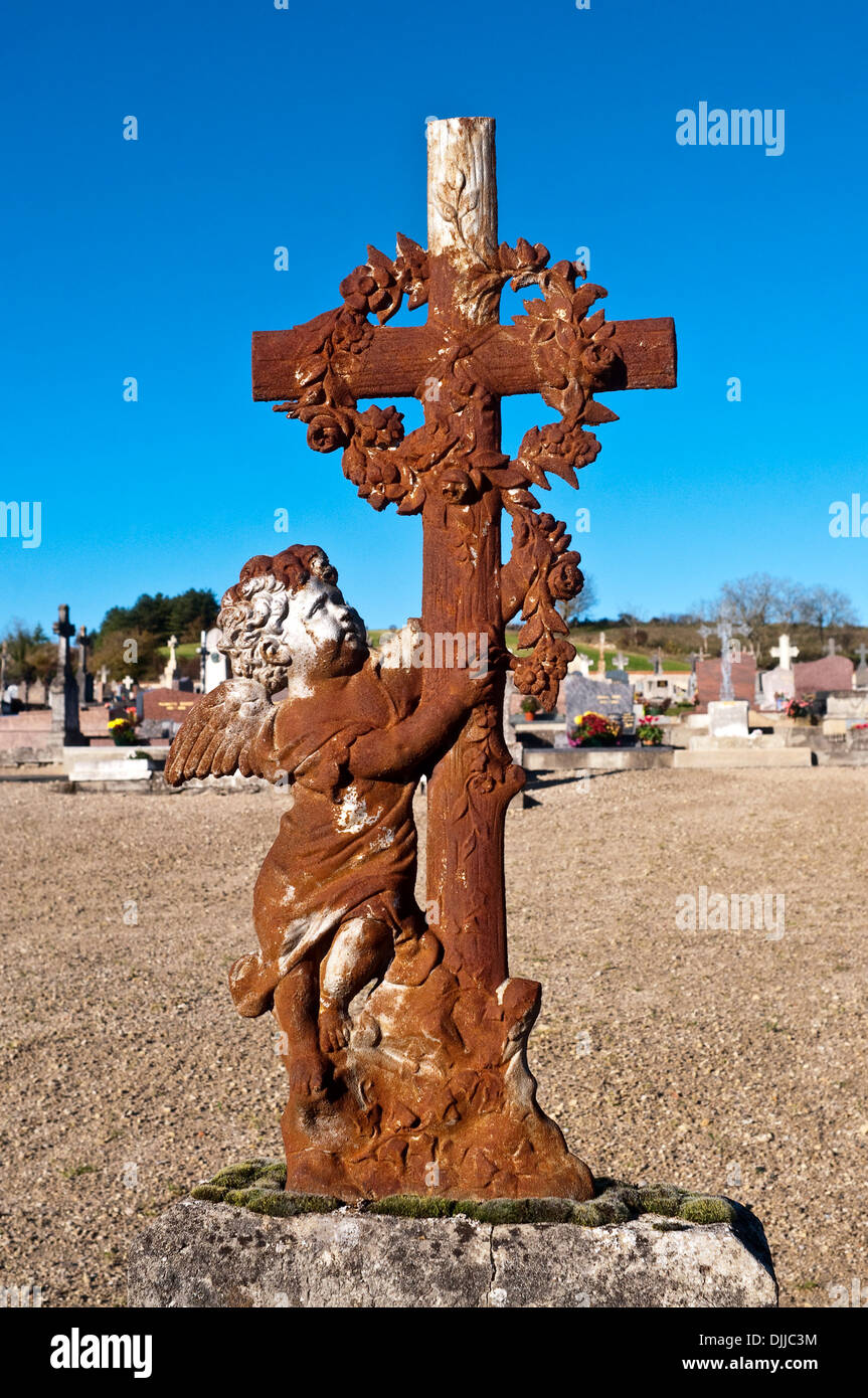 Old rusting cast-iron cross on grave in cemetery - France Stock Photo ...