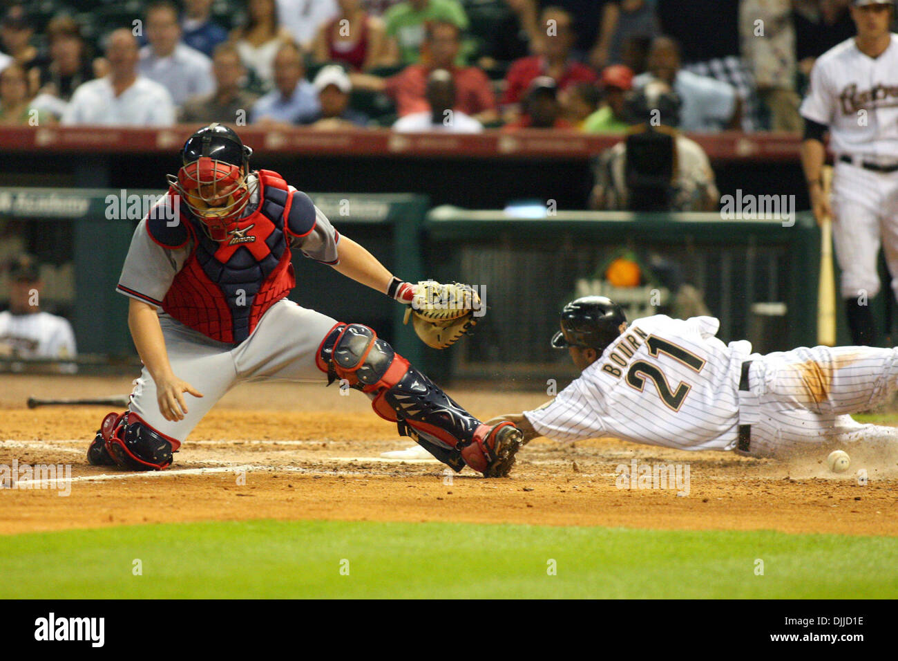 Houston Astros center fielder MICHAEL BOURN (21) slides safely into ...