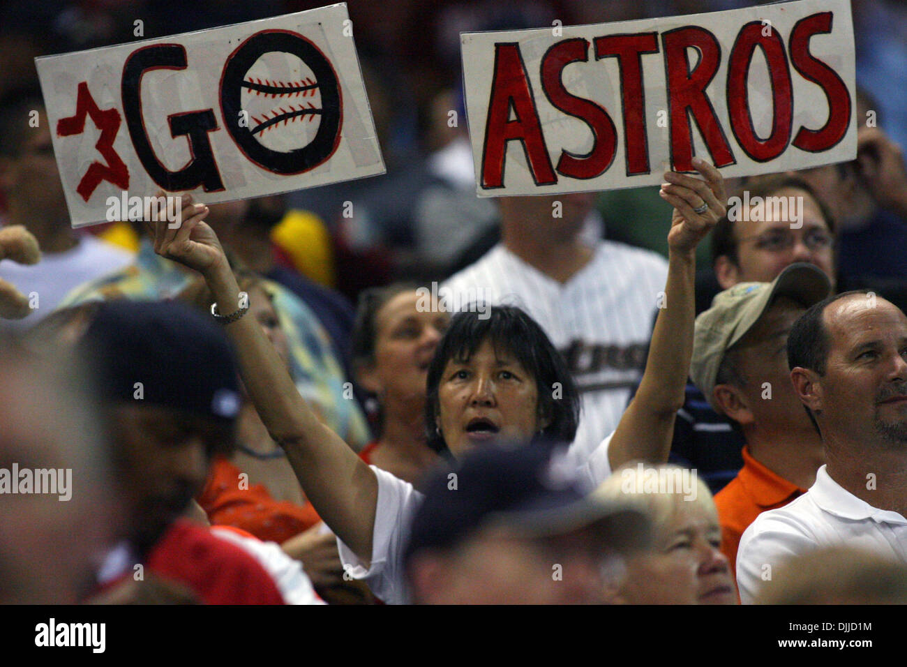 Houston Astros fan holding up Go Astros signs. The Atlanta Braves ...