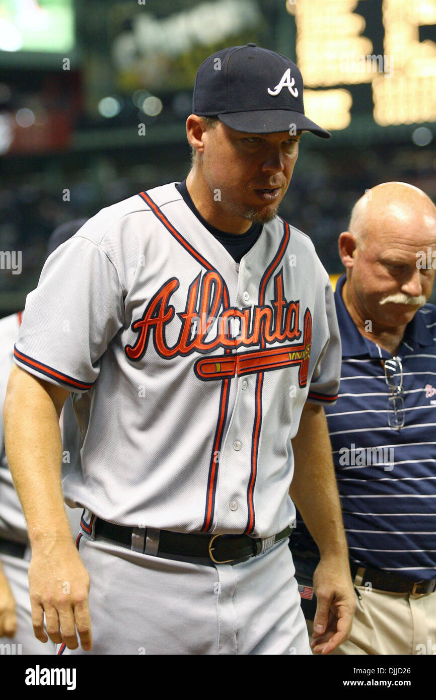 Atlanta Braves third baseman CHIPPER JONES .(10) gets helped off the ...