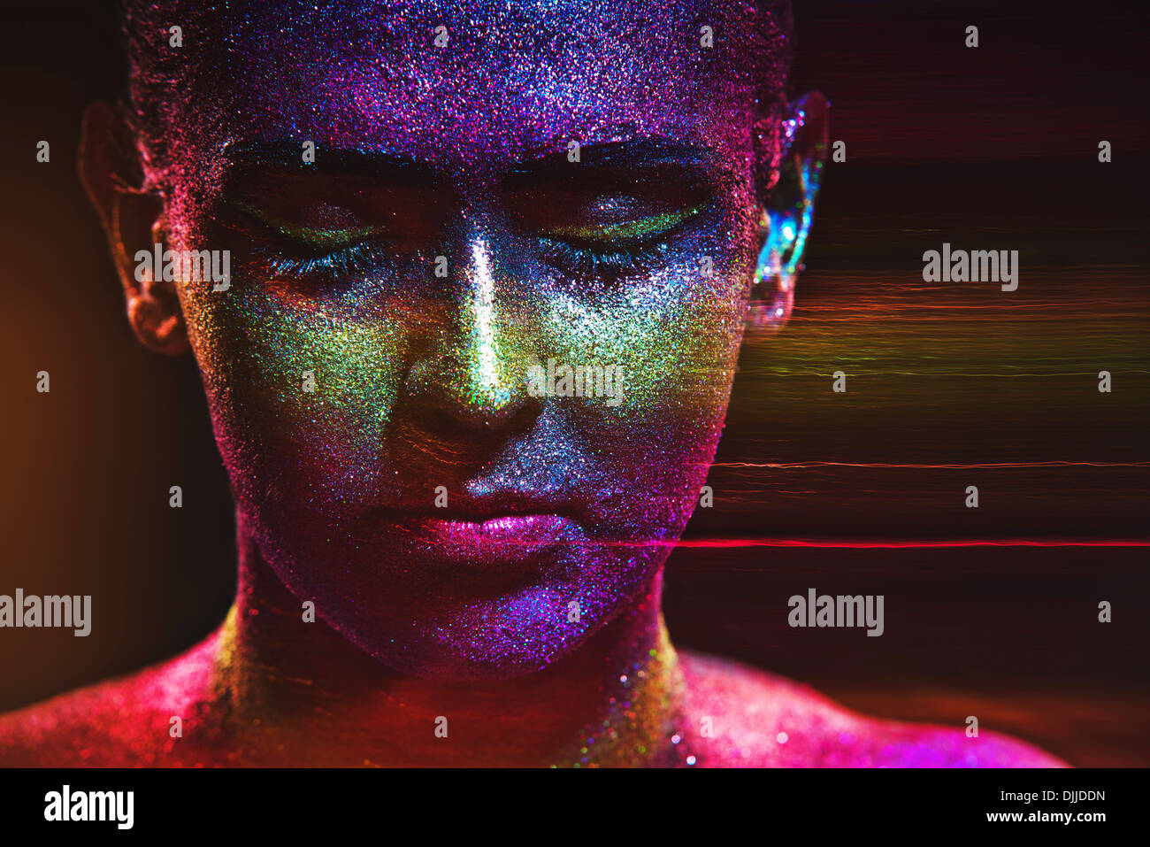 Glitter makeup on a beautiful woman face on a black background ...