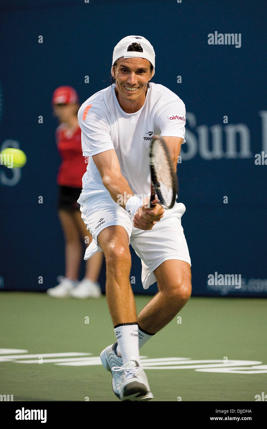 10 August, 2010..JUAN IGNACIO CHELA of Argentina hits a return backhand ...