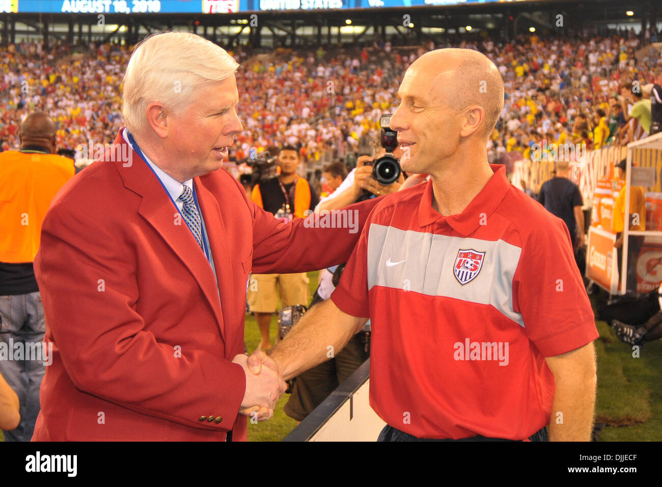 Kyle Rote, Jr greets USA Manager Bob Bradley prior to the kickoff of ...