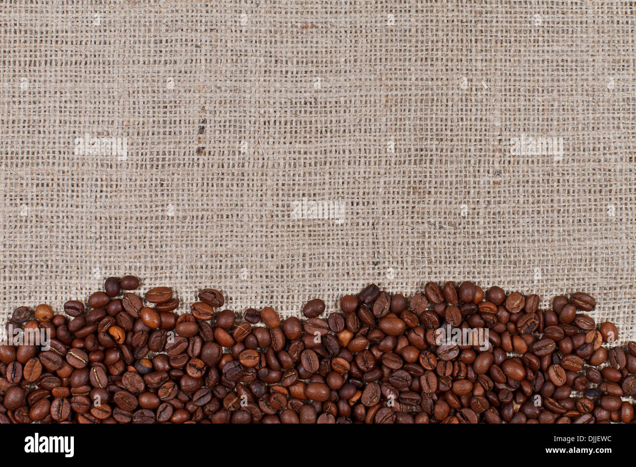 Cloth sack background with coffee seeds on bottom side Stock Photo - Alamy