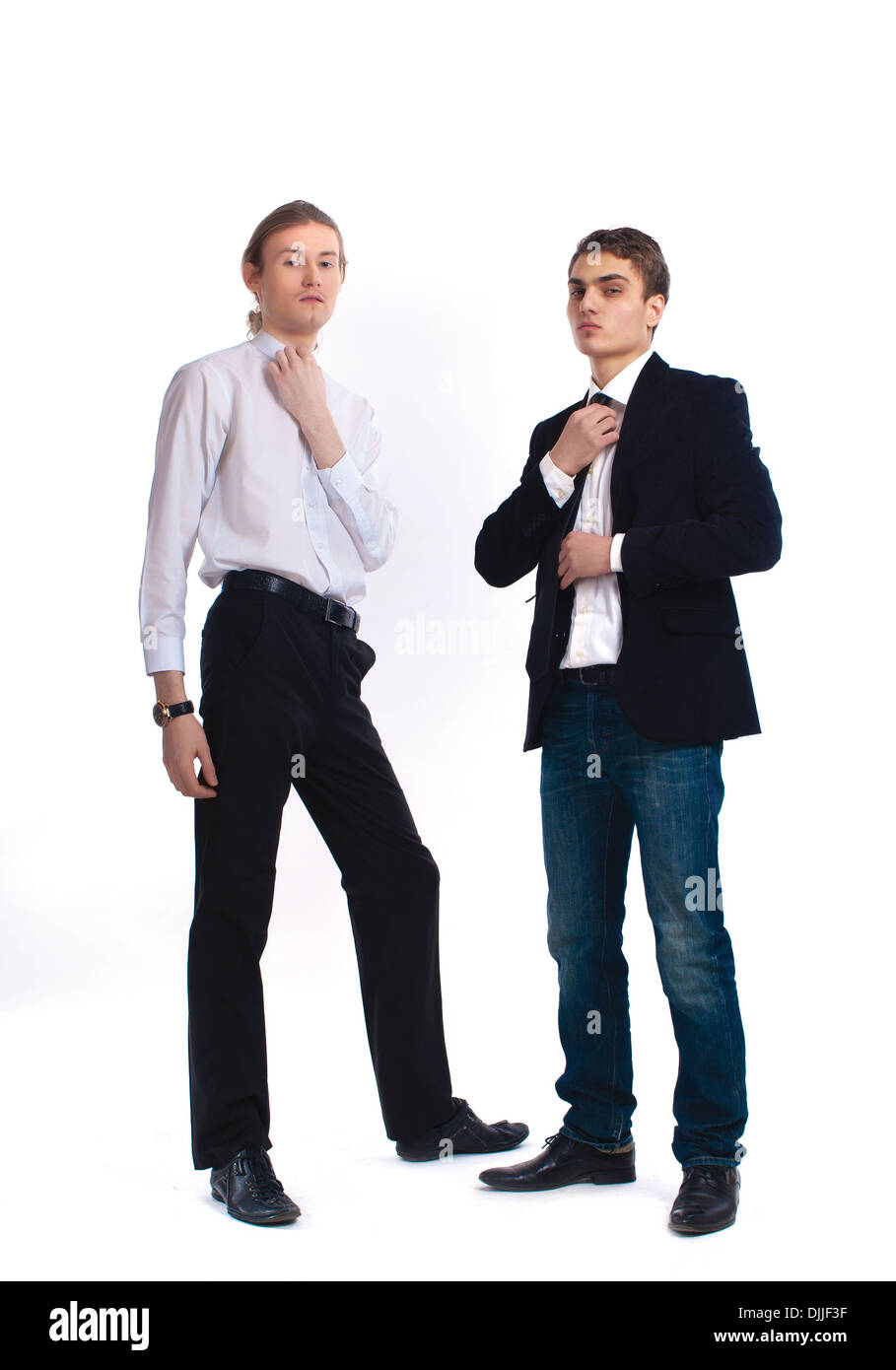 two fashionable young men on a white background Stock Photo - Alamy