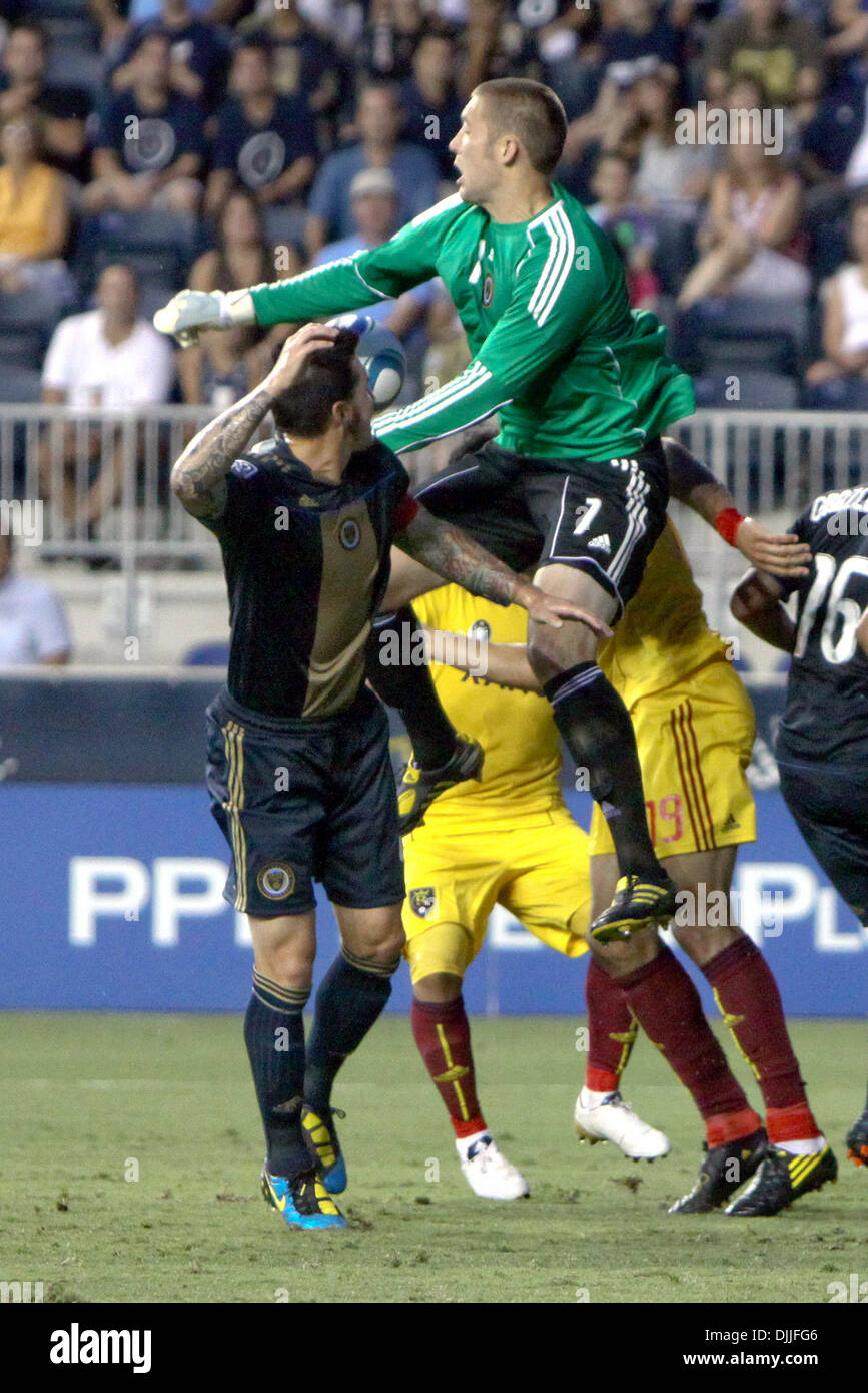 Philadelphia Union goalkeeper CHRIS SEITZ (#1) jumps over defender ...