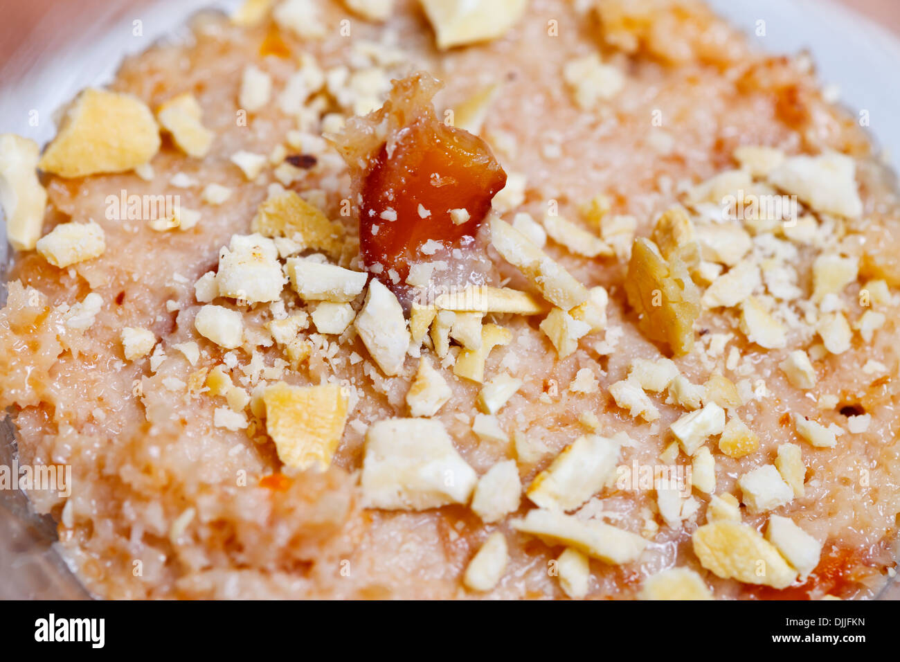 Grated coconut cooked and simmered with cream and nuts Stock Photo - Alamy