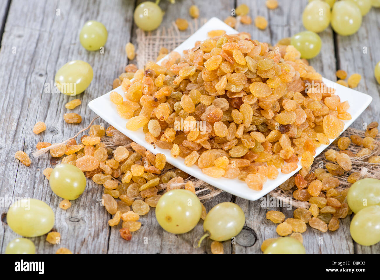Portion of dried Grapes with some fresh fruits Stock Photo - Alamy