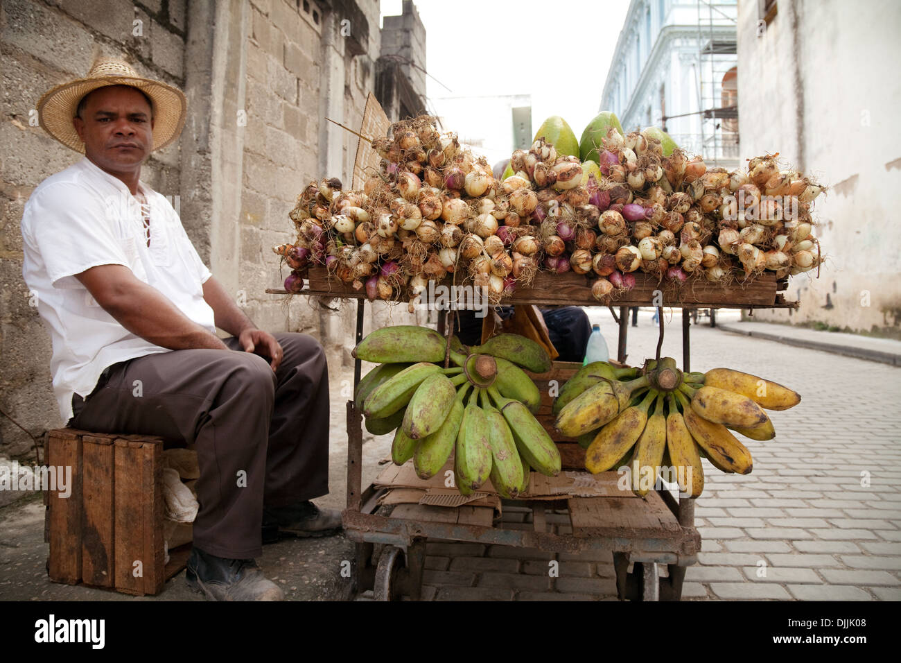 Cuba street food - A stallkeeper and his fruit stall, Brasil St, Havana ...