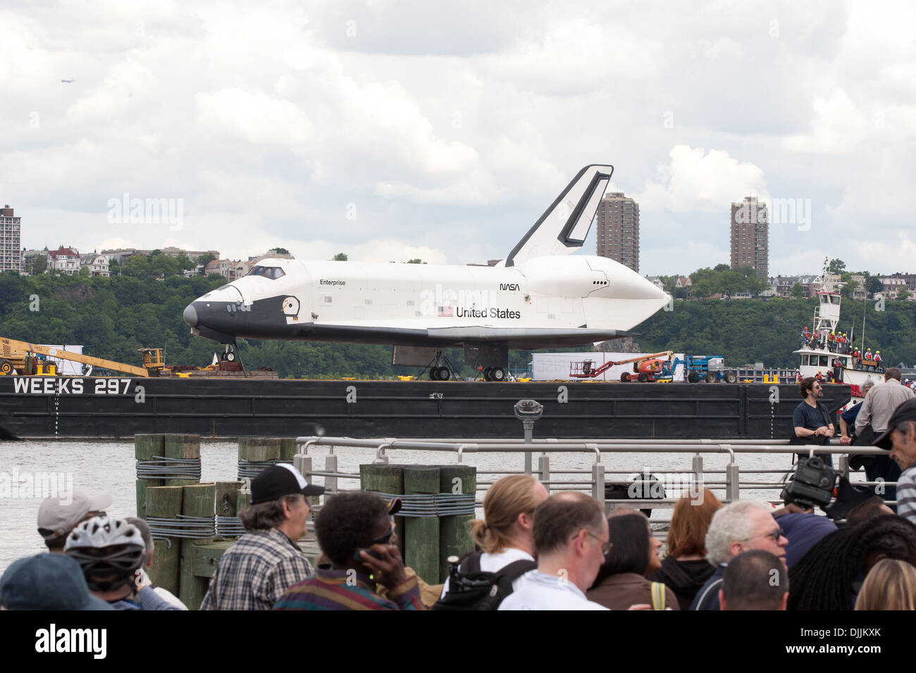 The NASA space shuttle prototype Enterprise waits to be hoisted by crane into its final resting ...