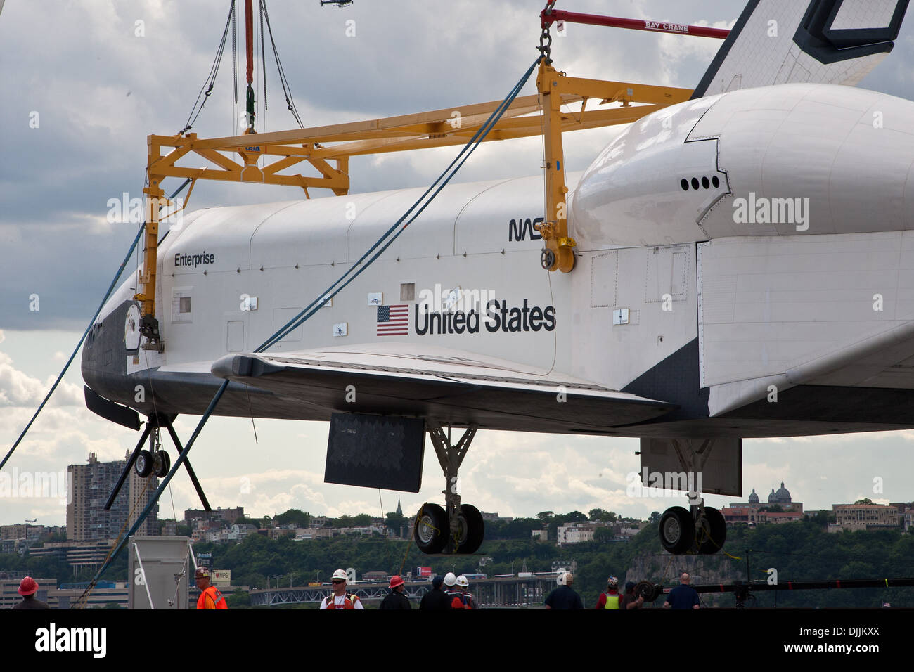 The NASA space shuttle prototype Enterprise is lowered by crane into ...