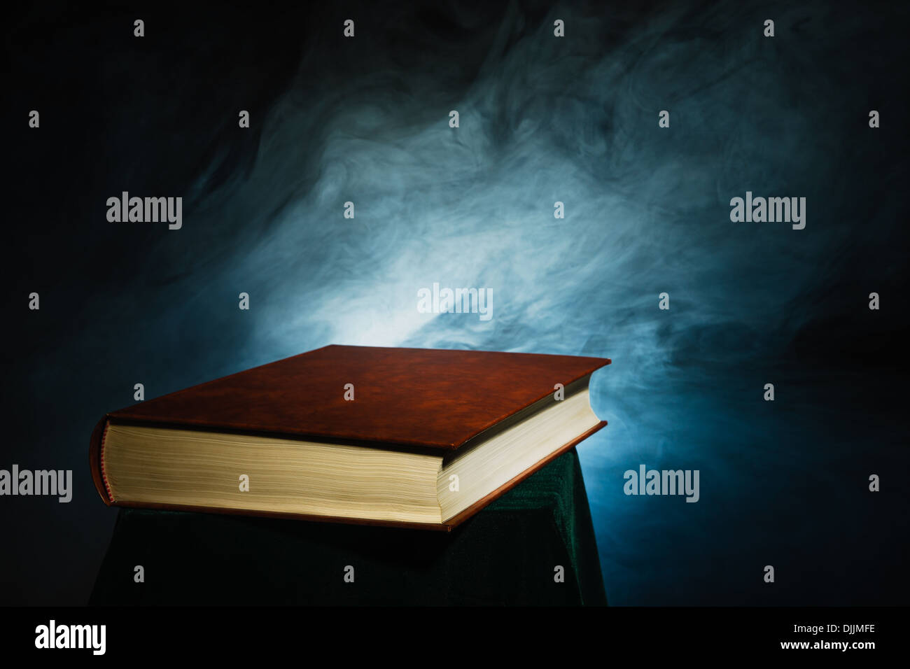 Unopened big book and smoke, dark background, horizon format Stock ...