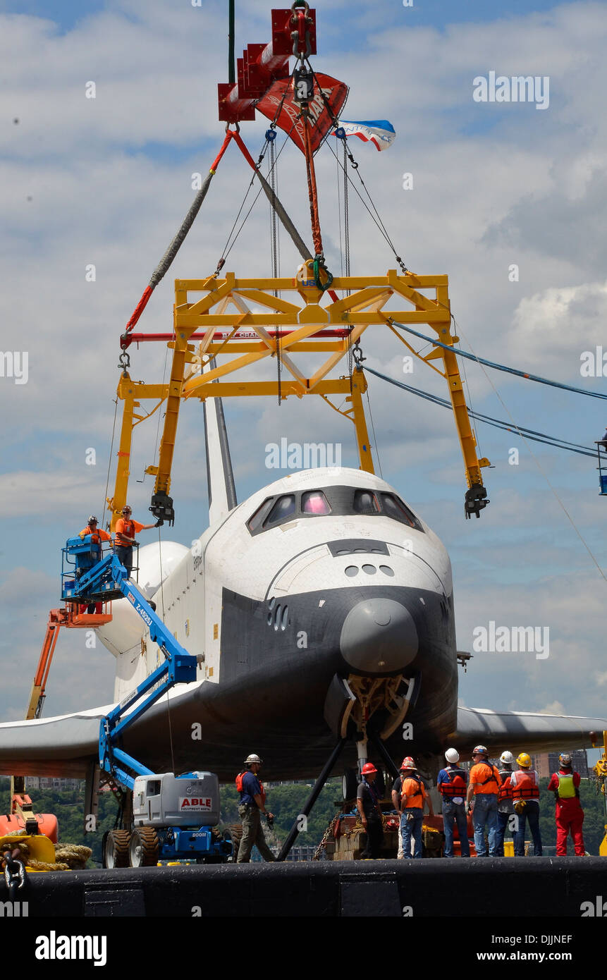 The NASA space shuttle prototype Enterprise waits to be hoisted by ...