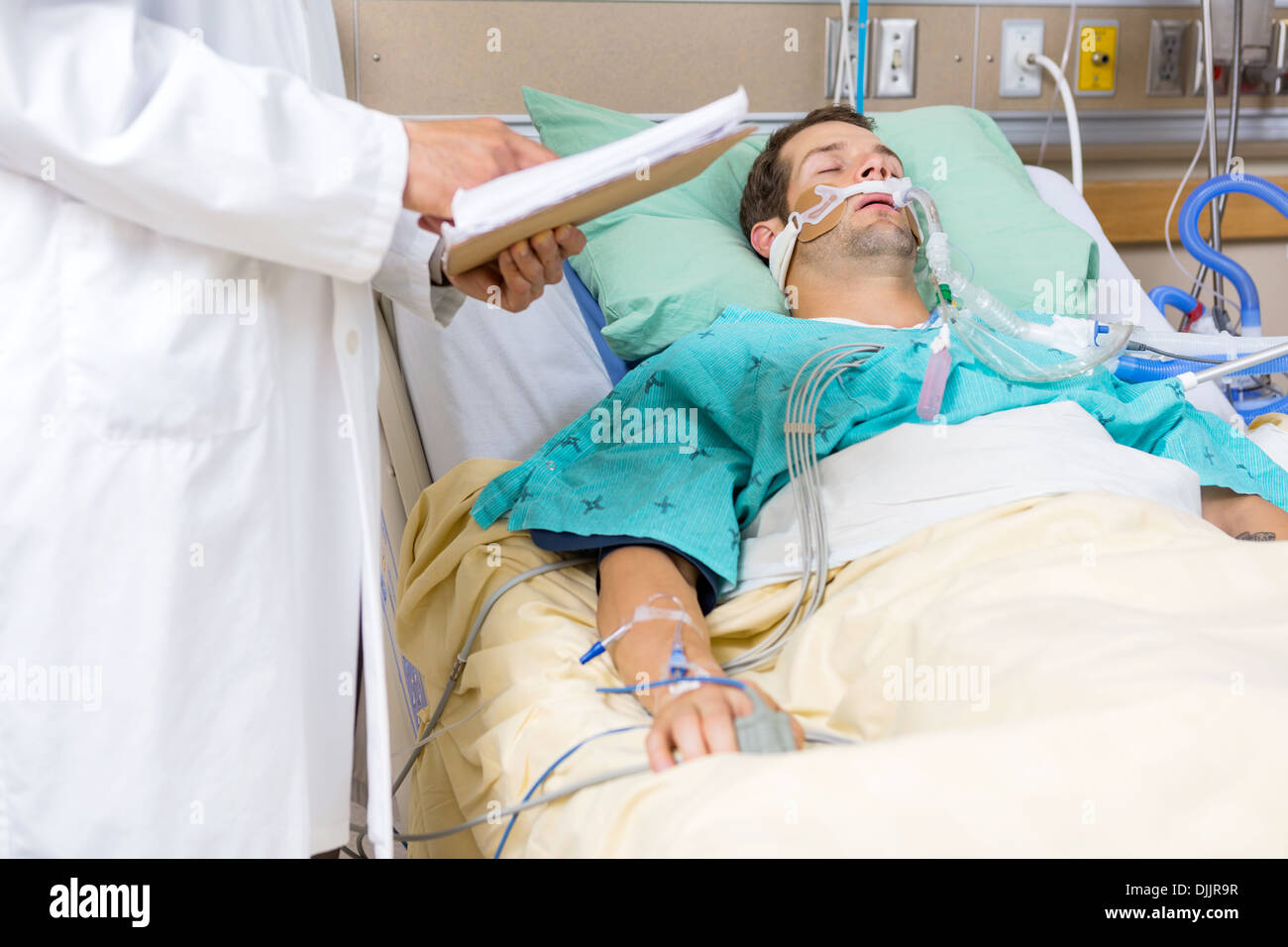 Doctor Examining Male Patient's Test Report Stock Photo - Alamy