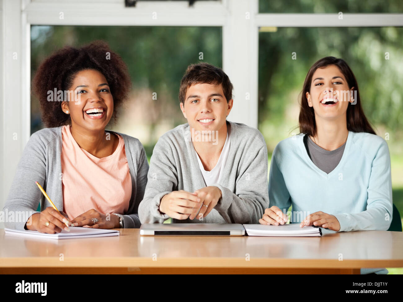 Student With Friends Sitting At Desk In Classroom Stock Photo - Alamy