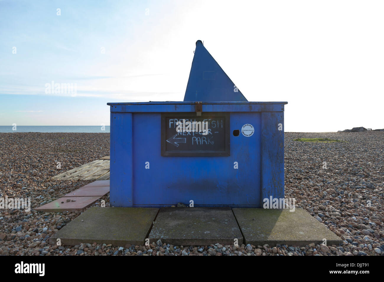 Sign on a blue metal container pointing to fresh fish Stock Photo - Alamy