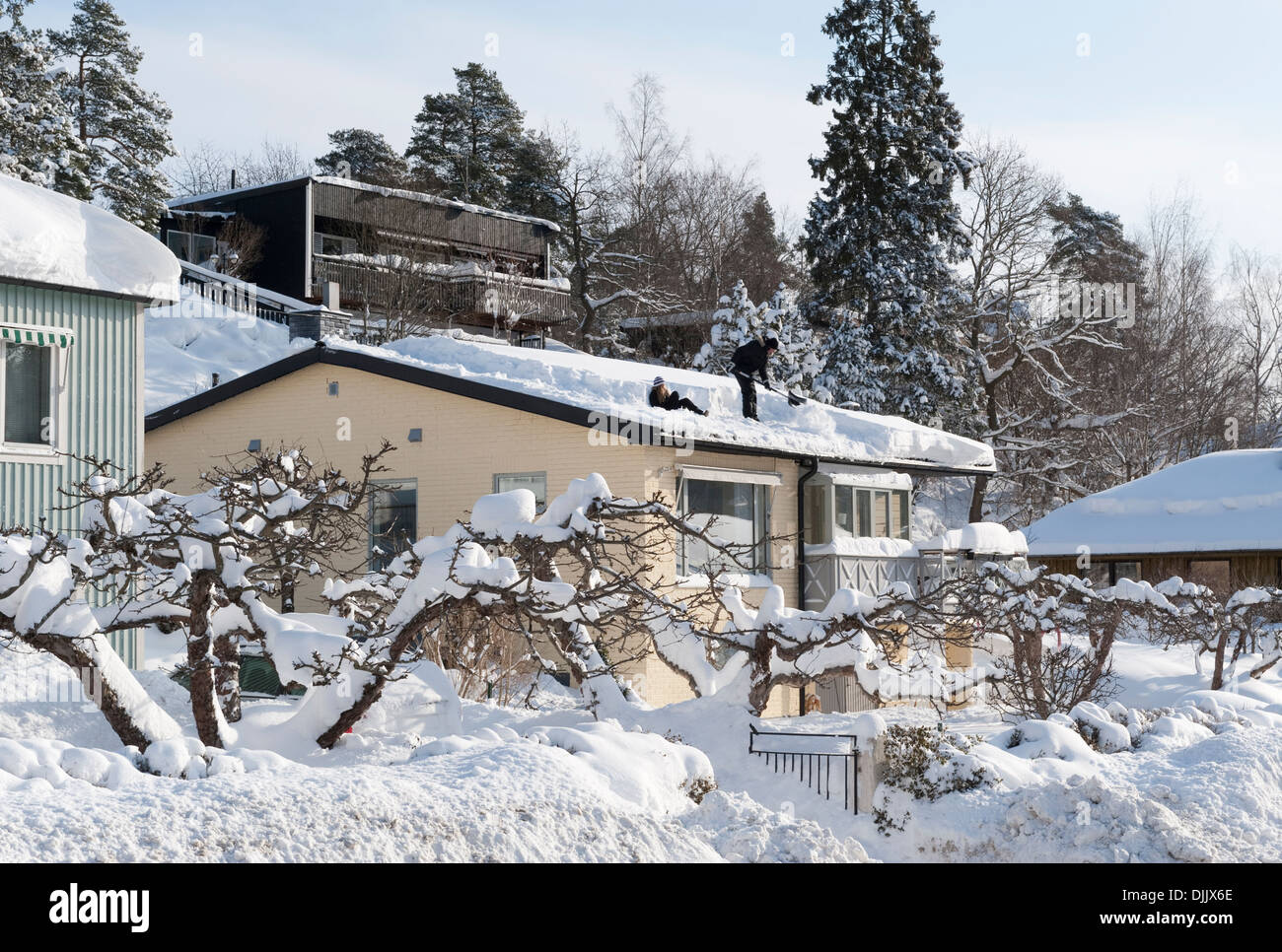 Two people shovel snow hi-res stock photography and images - Alamy