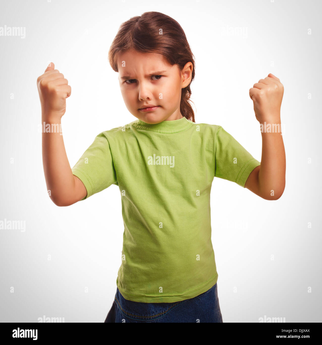 Angry evil girl shows fists experiencing anger and anger emotions Stock ...