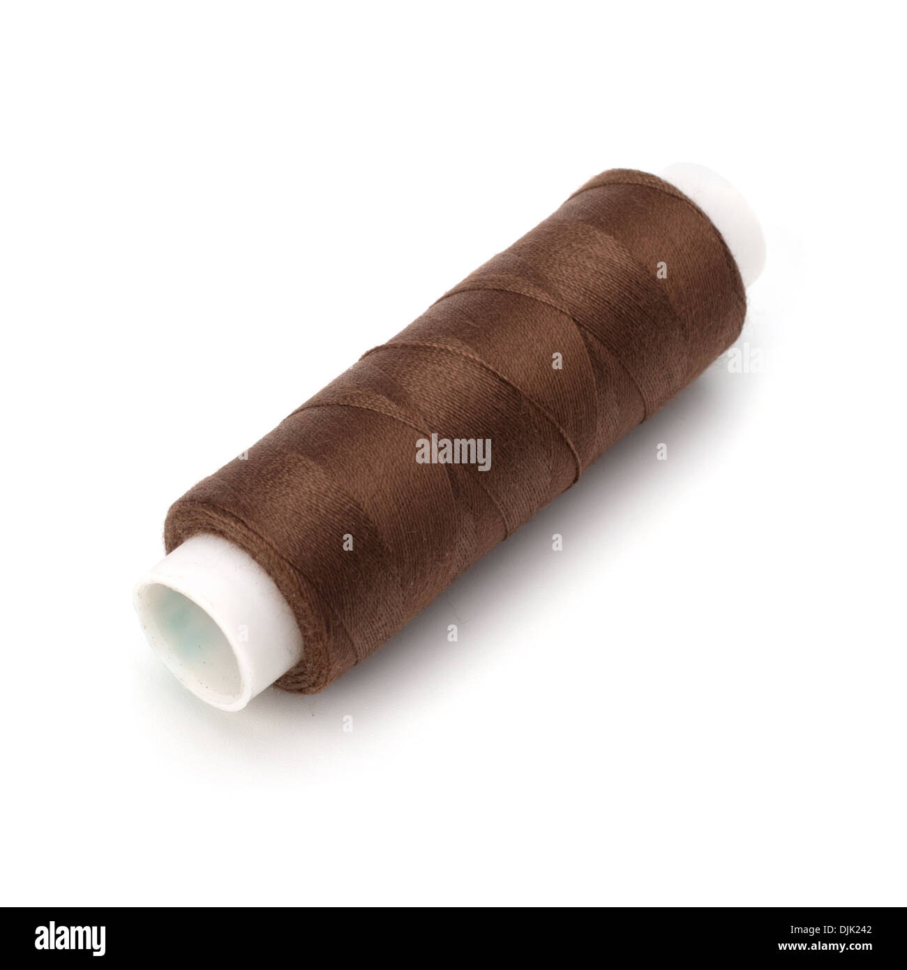 Brown spool of thread isolated on white background Stock Photo - Alamy