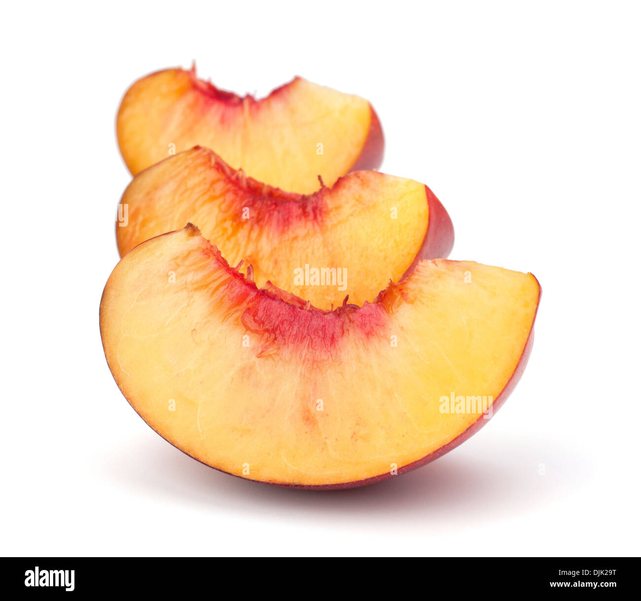 Nectarine fruit segments isolated on white background Stock Photo - Alamy