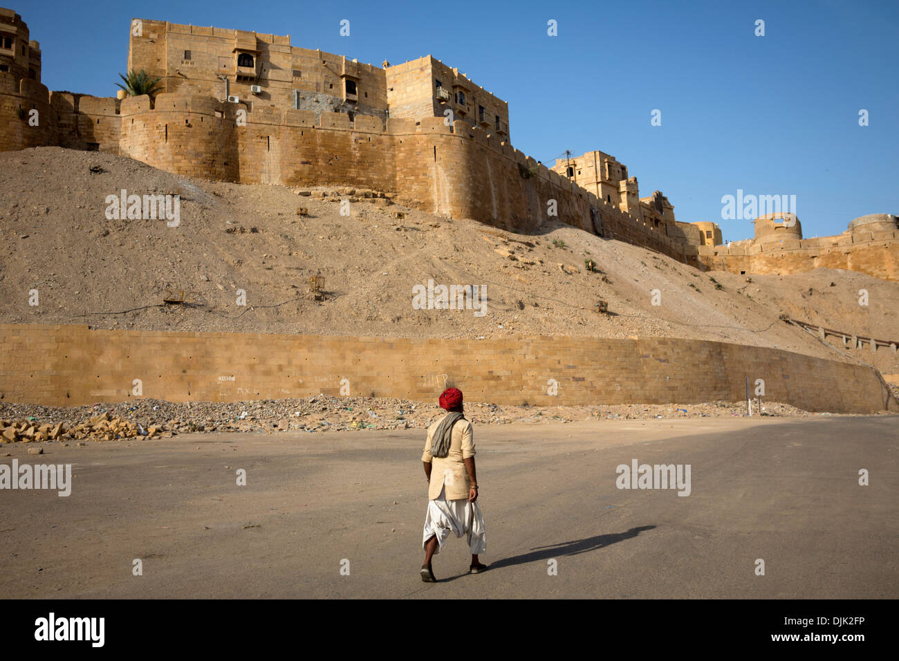 A man walks along the ramparts of the fort that crowns the Trikuta hill ...
