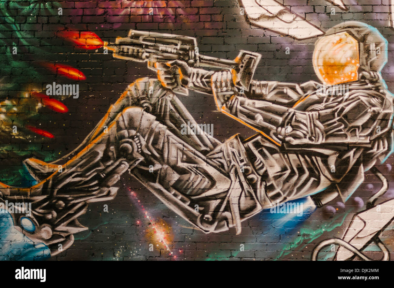 Colorful graffiti in Deep Elllum depicting a fighting astronaut firing ...