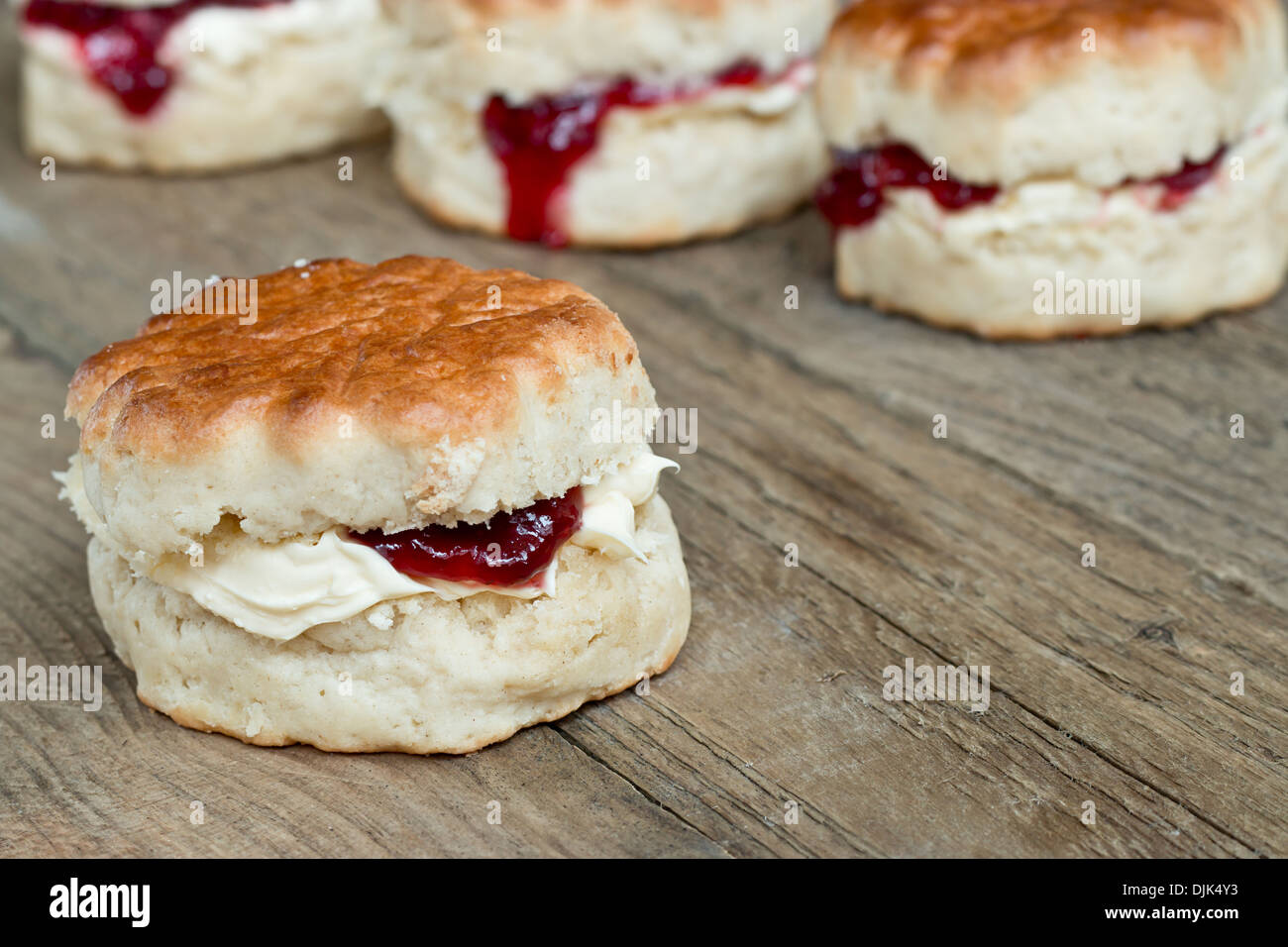 Cornish Cream Tea of scones filled with clotted cream and strawberry ...