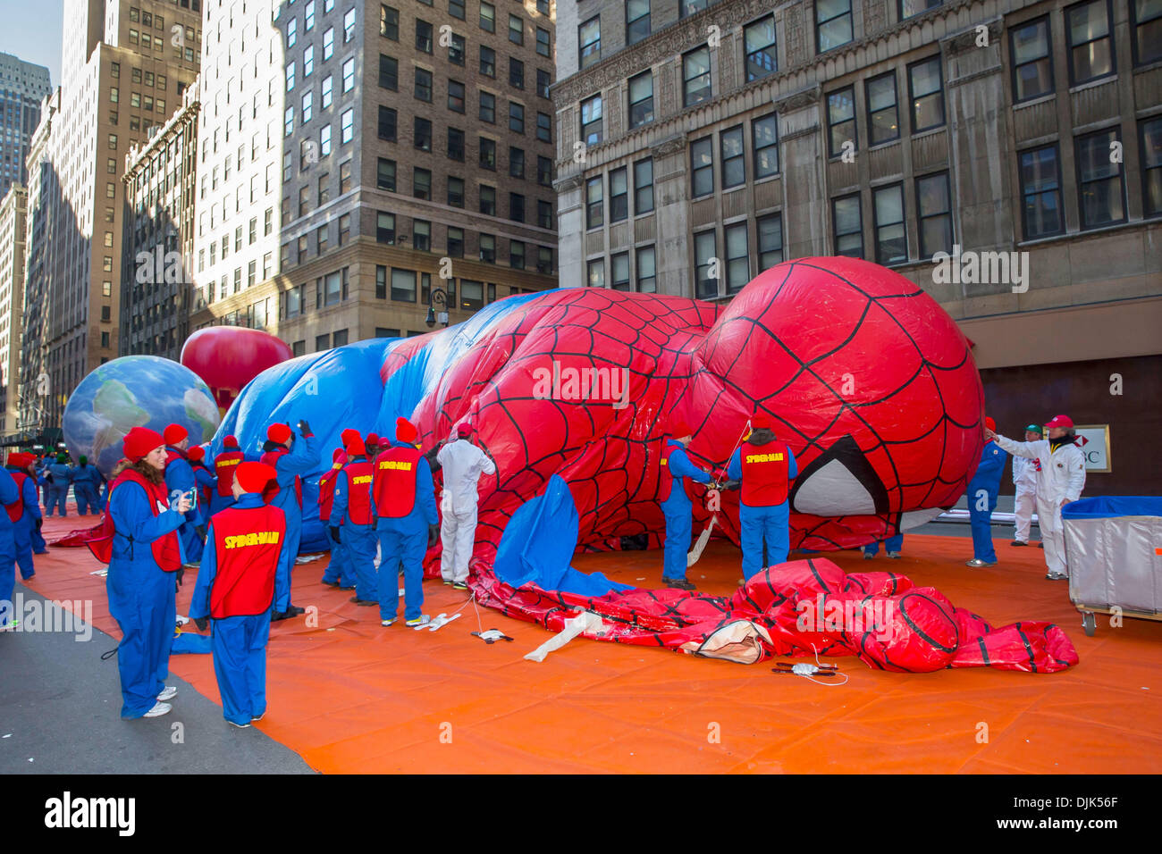 New York, USA. 28th November 2013. The Spiderman balloon is deflated ...