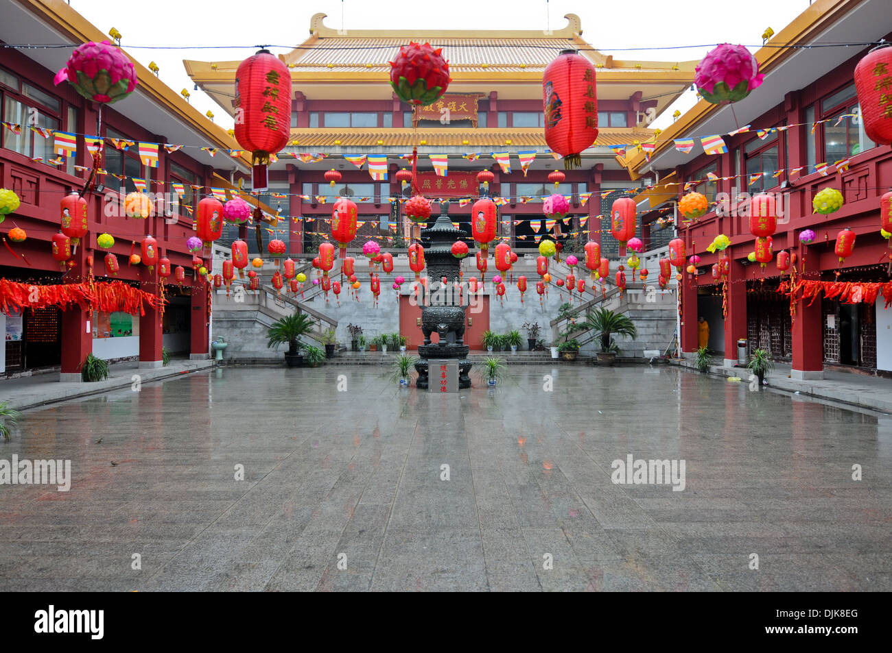 Courtyard with Incenses burner and red chinese lanterns in Qibao Temple ...