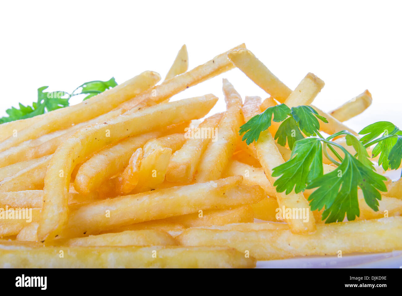 french fries in close shot with parsley Stock Photo - Alamy