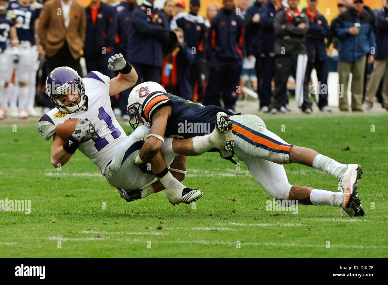 11, Northwestern Wide Receiver Jeremy Ebert takes taken to the turf ...