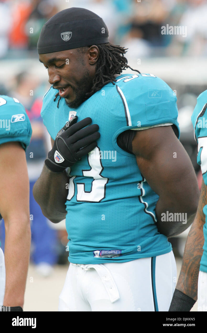 Greg Jones stands during the National Anthem before the game between ...