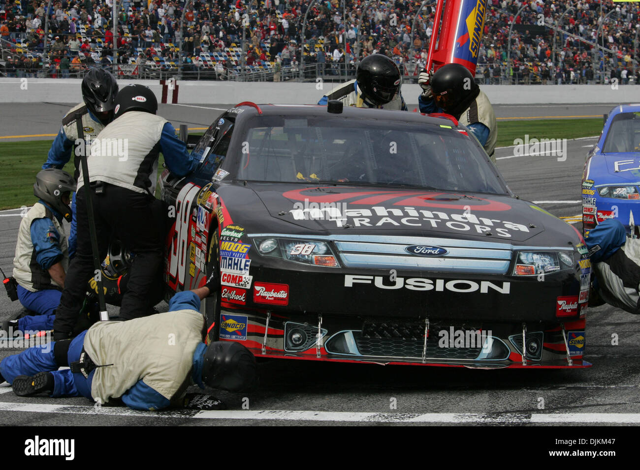 Mike Bliss' car gets serviced in the pits during the first Gatorade ...