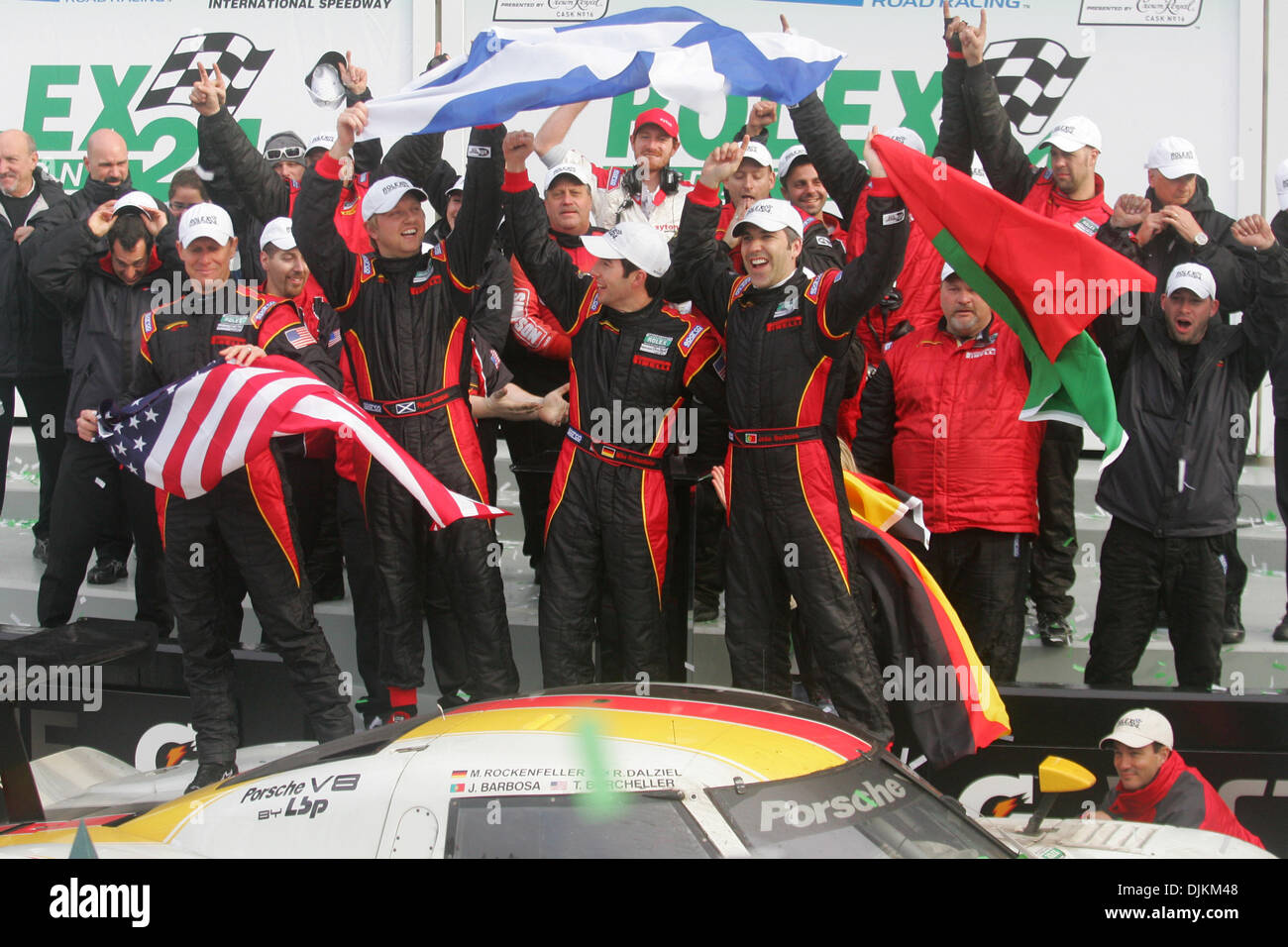 Members of the overall winning Action Express Racing team celebrate its ...