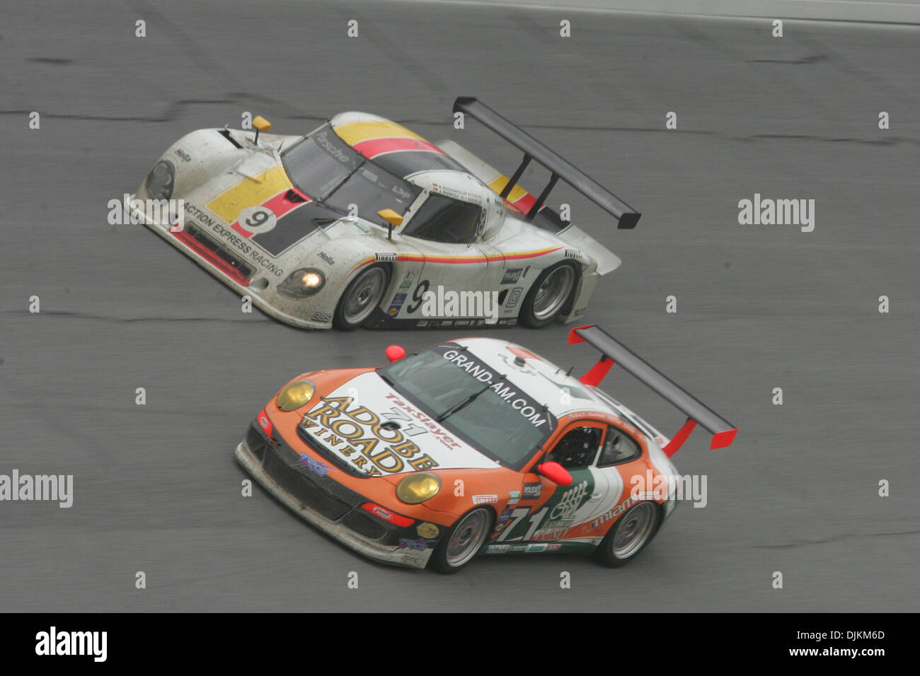 The No. 9 Porsche Riley races past the No. 71 Porsche GT3 Cup during ...