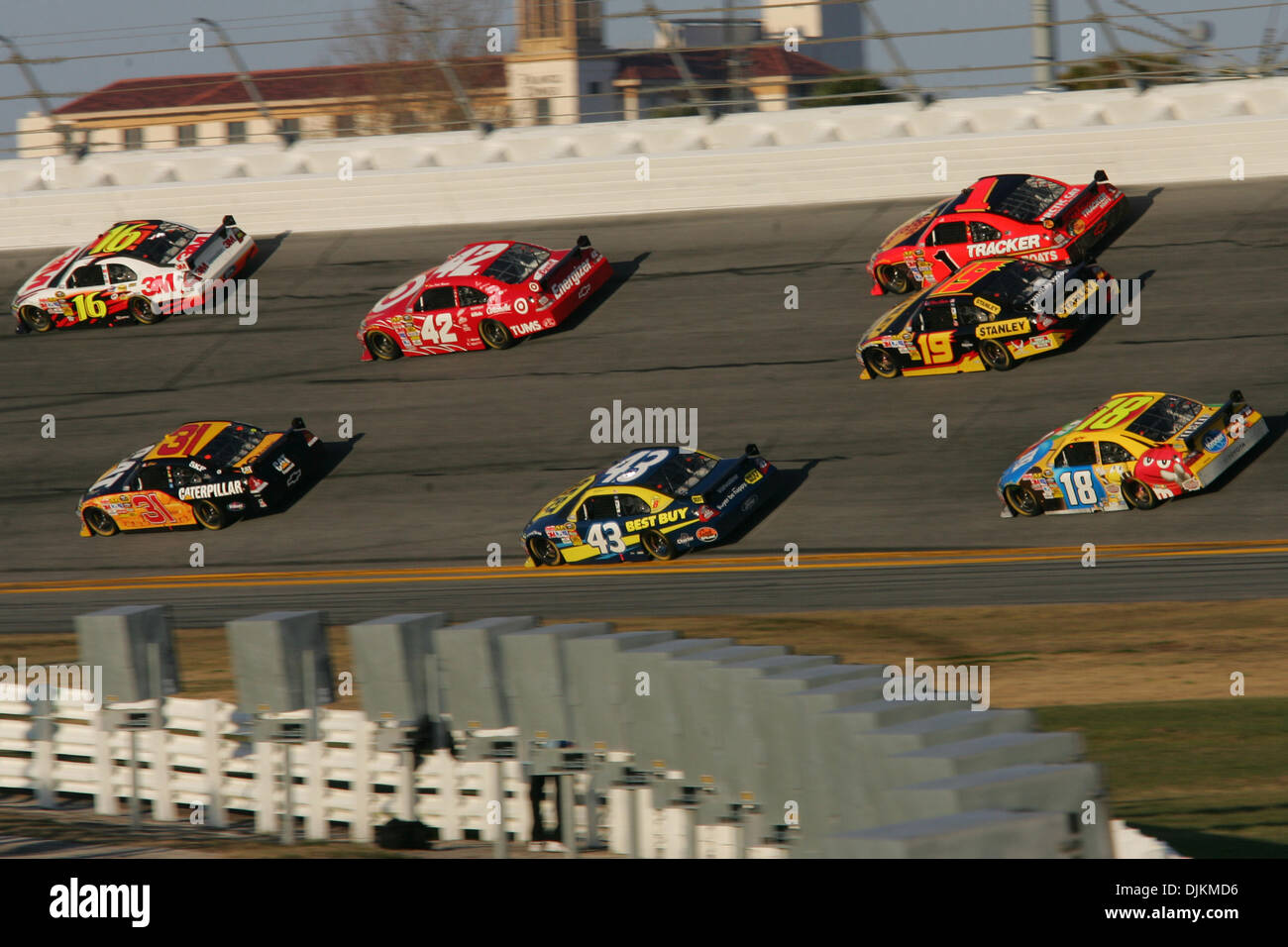 A pack of cars race through Turn 3 during the Daytona 500 at the ...