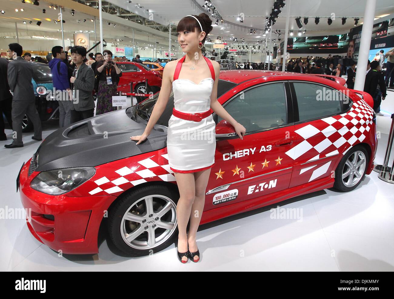 Beijing, CHINA, China. 23rd April, 2010. A Chinese model poses next to ...