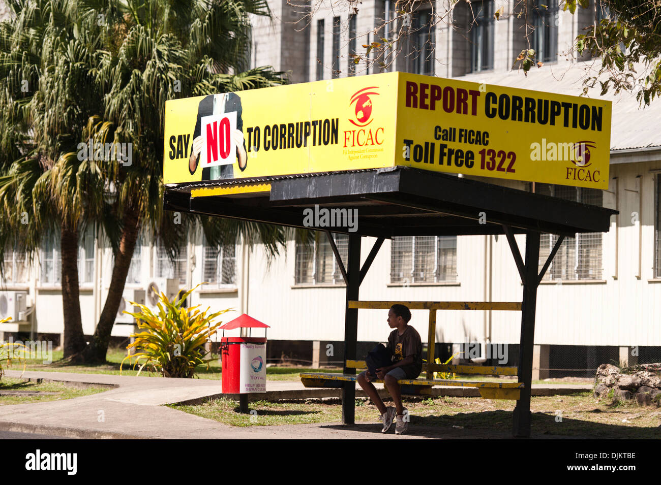 Anti Corruption signs on a bus stop outside the Ministry of Justice ...