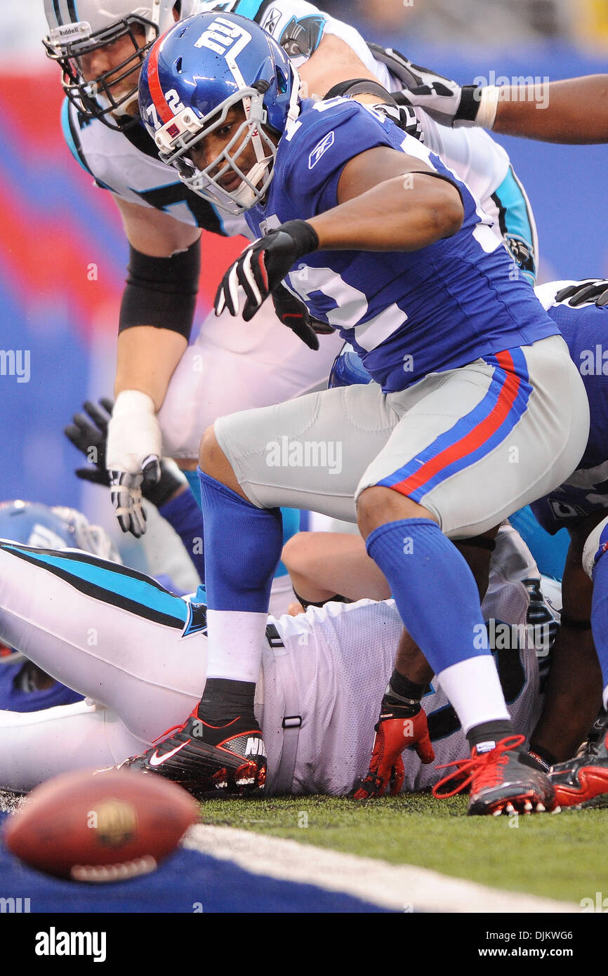 New York Giants defensive end Osi Umenyiora (72) watches the ball he ...