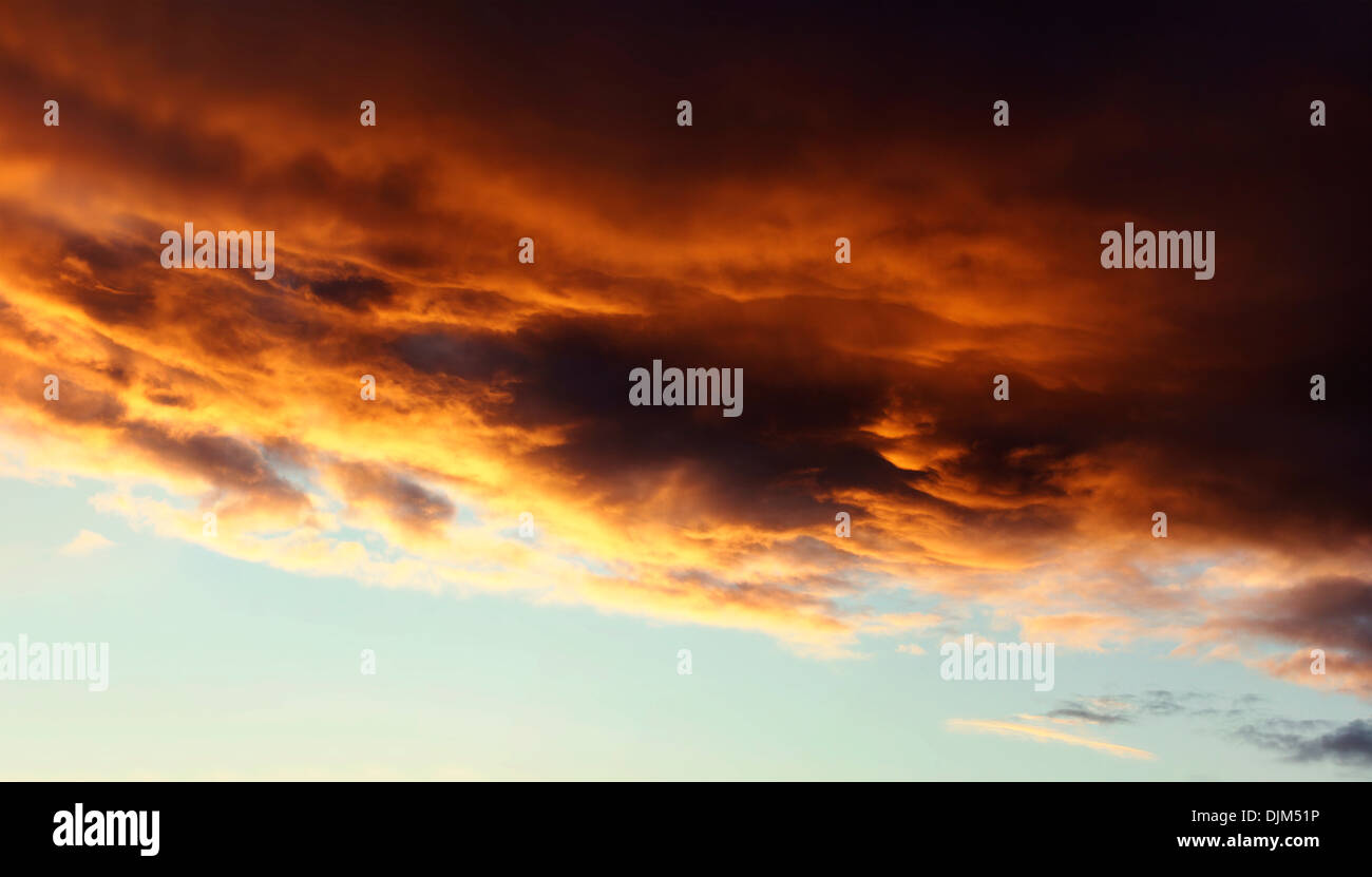 Orange colors in summer clouds Stock Photo - Alamy
