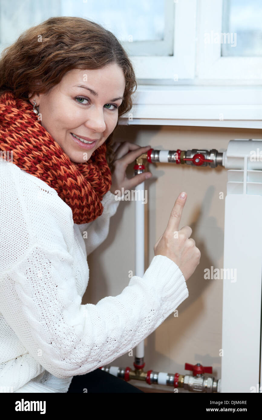 Woman sitting on radiator hi-res stock photography and images - Alamy