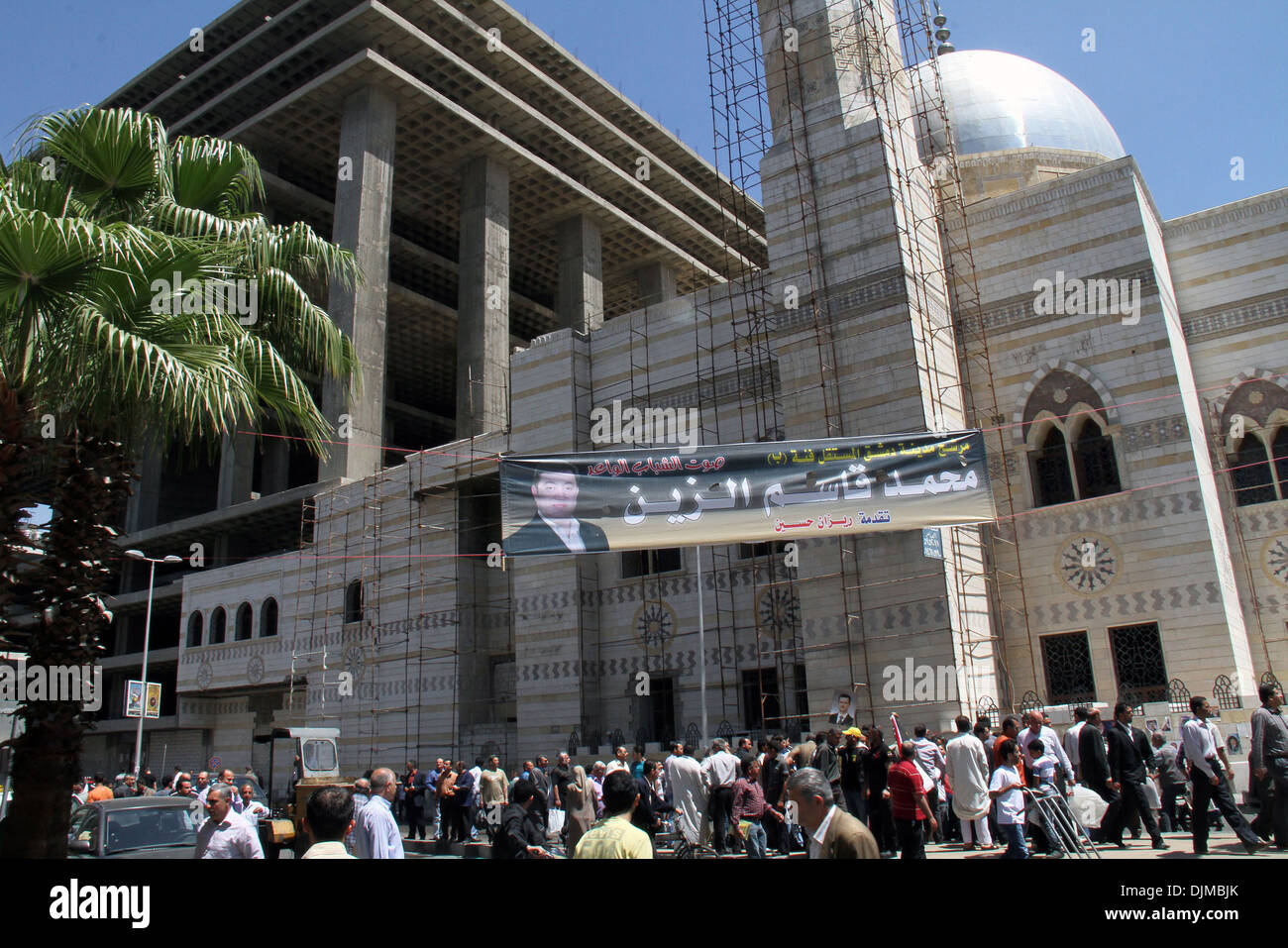 Syrians hold up national flags and posters of Syrian President Bashar ...